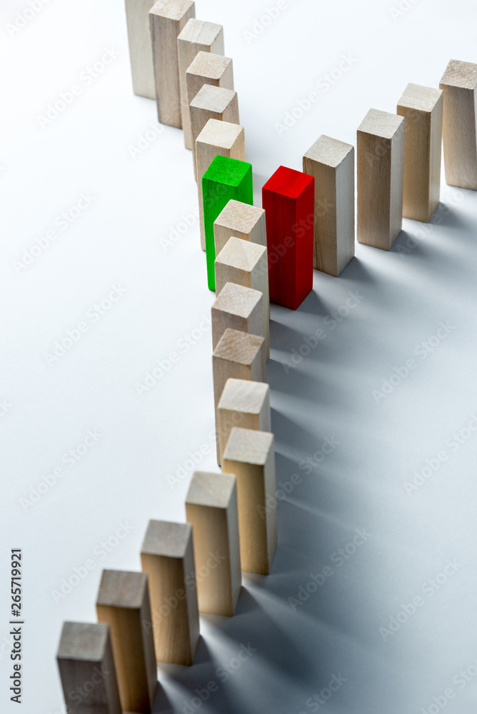 The long curved line of wooden cubes is divided into two after the red ...