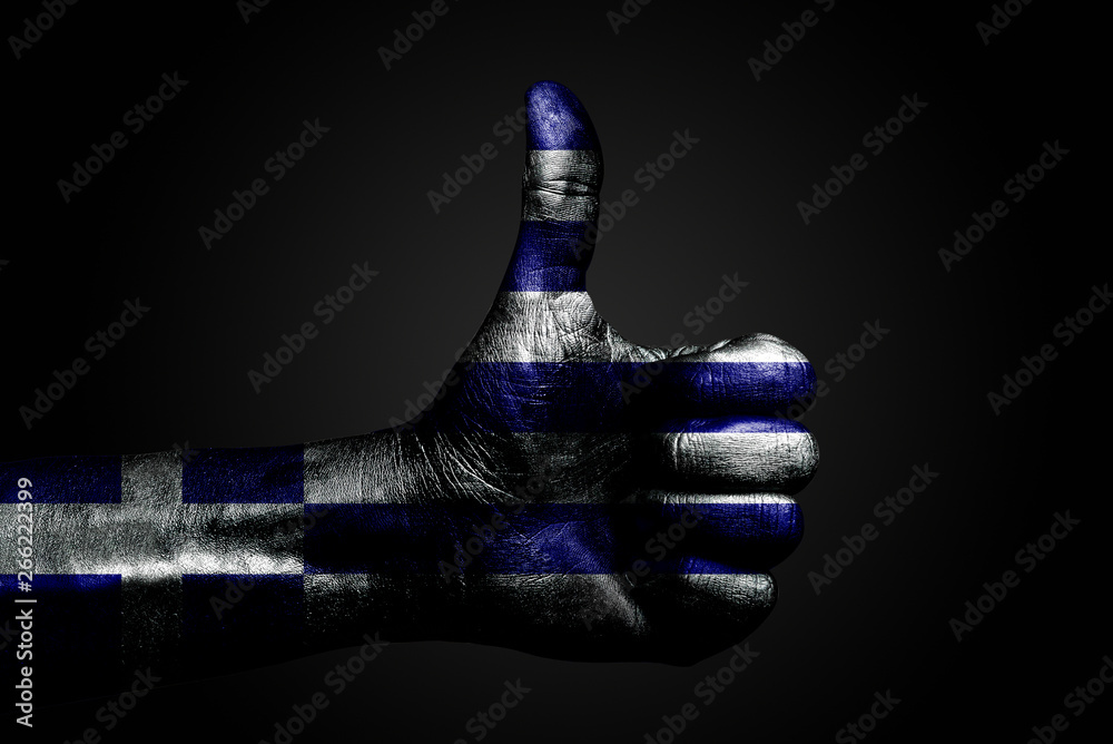 A hand with a drawn Greece flag shows a finger up sign, a symbol of ...