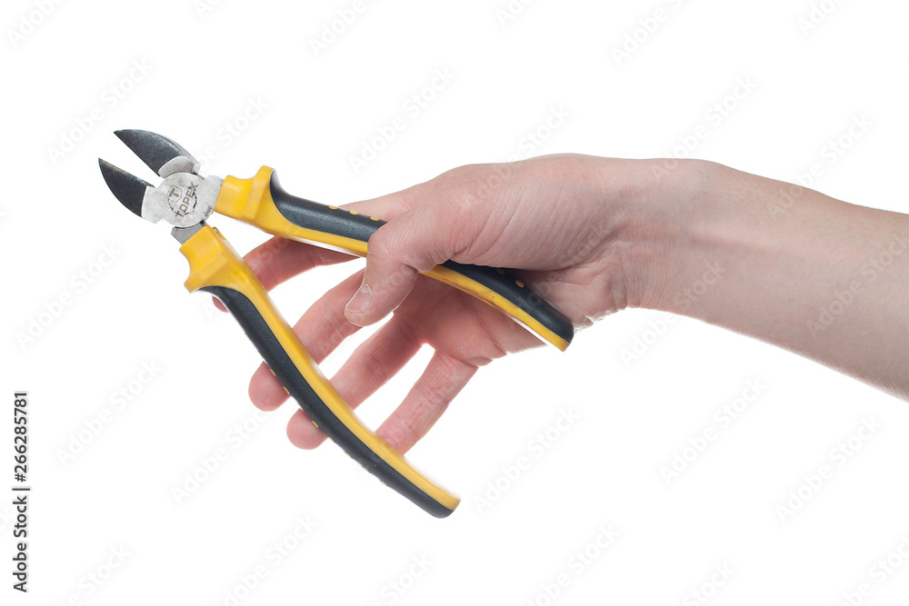 Man's hand holding a black and yellow wire cutter. Open, clean, ready ...