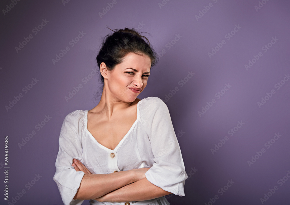 Beautiful unhappy woman in white shirt looking with disgust and ...
