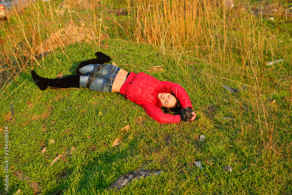 corpse of a young girl lies on a landfill Stock Photo | Adobe Stock