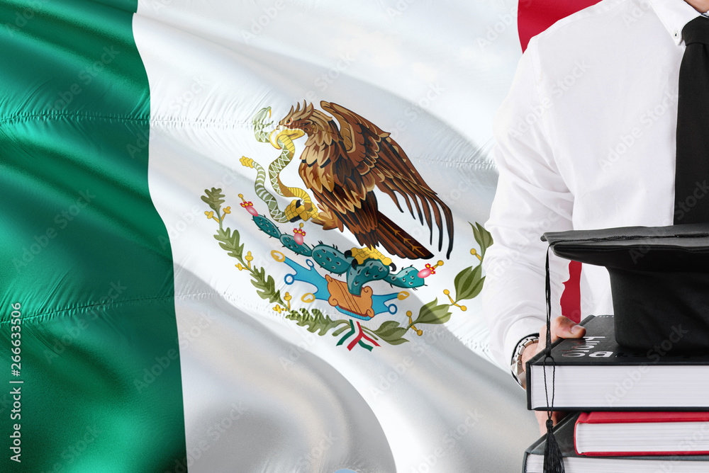 Successful Mexican student education concept. Holding books and ...