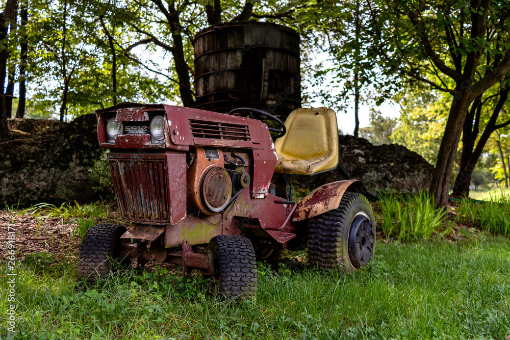 Rusty and vintage riding lawn mower in a vineyard Stock Photo Adobe Stock