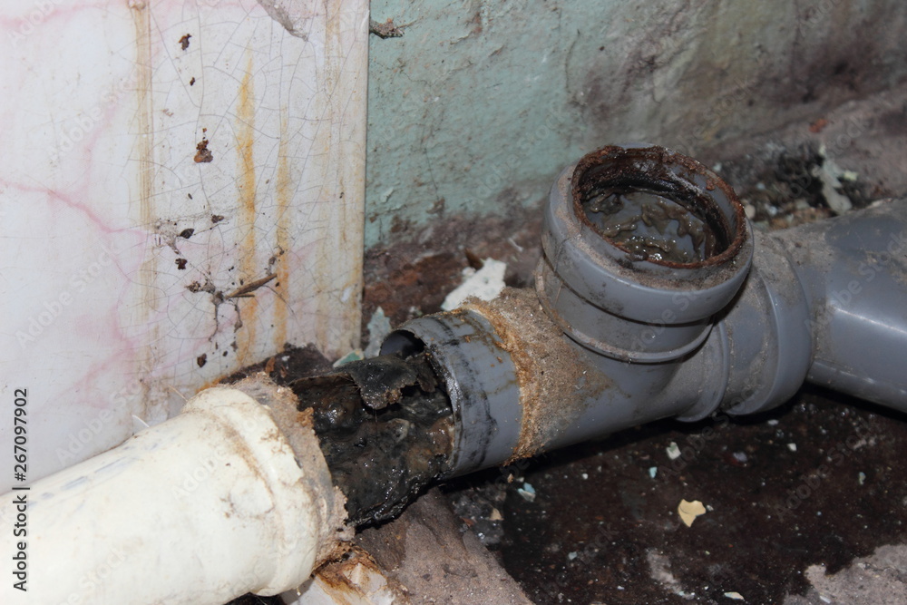 Clog in disconnected old plastic drainage pipe, plumbing demounting and ...