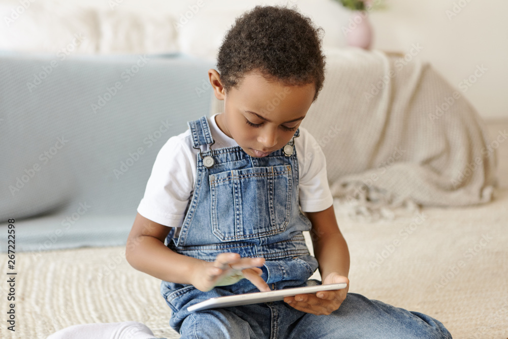 Gadgets, electronic devices and new generation concept. Curious African ...