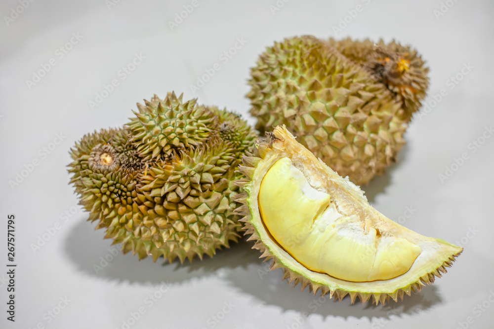 Hand peeling durian shell by knife. The durian is a king of fruit and ...