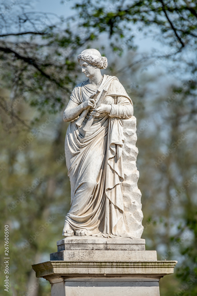 Ancient statue of a sensual renaissance era woman with musical ...