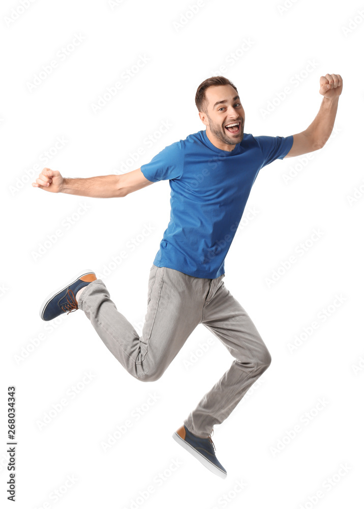 Full length portrait of happy handsome man jumping on white background ...