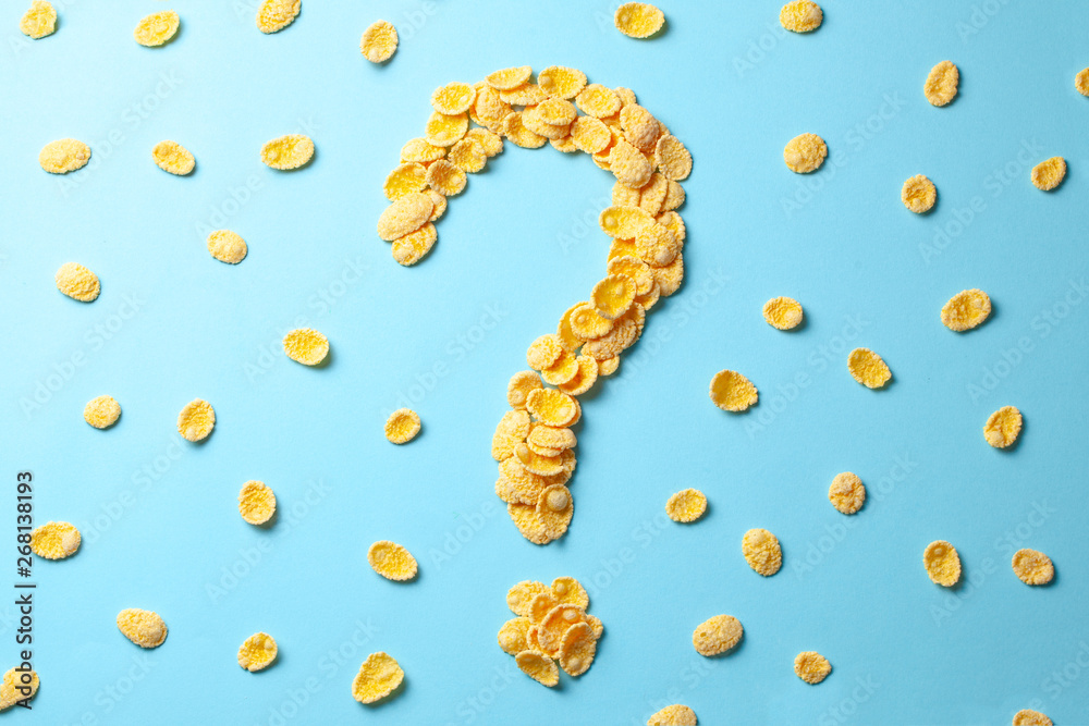 Yellow flakes in the shape of a question mark on a blue background. How ...