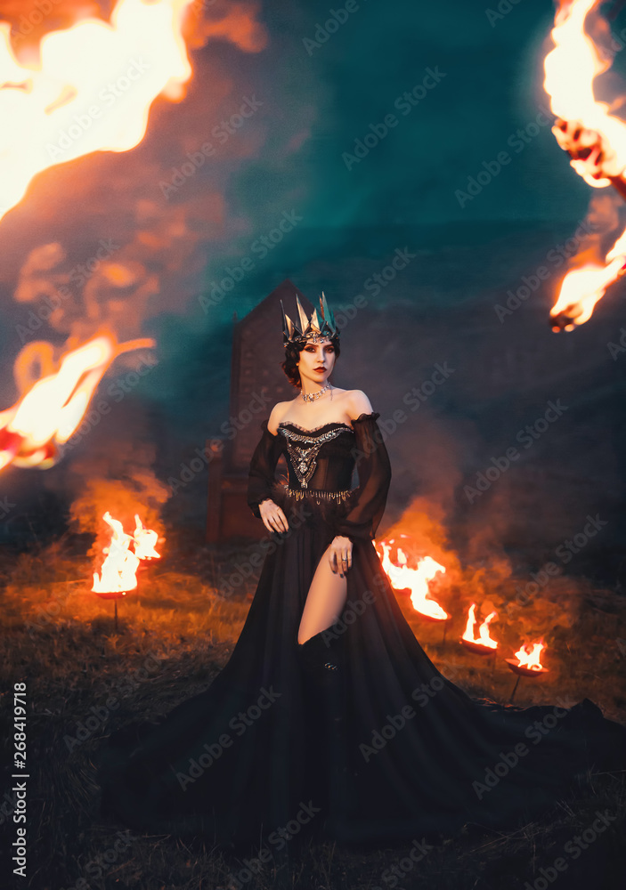 dark queen of night, majestic priestess in long black dress with bare ...