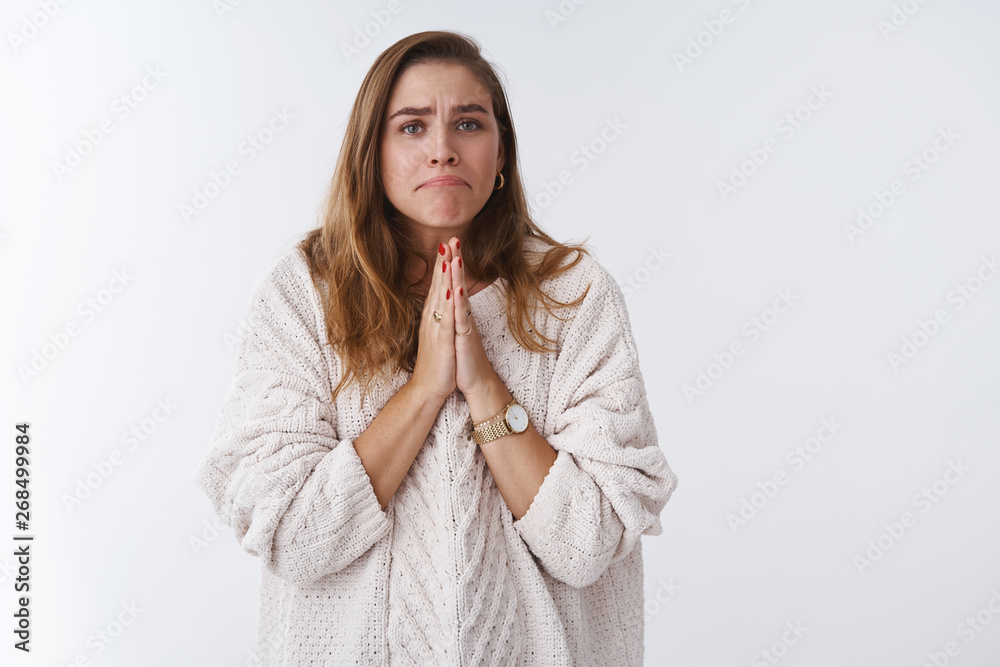 Girl acting silly miserable supplicating pressing palms together pray ...