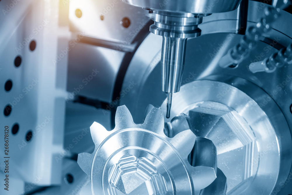 The 5-axis CNC milling machine cutting the metal gear parts with ball ...