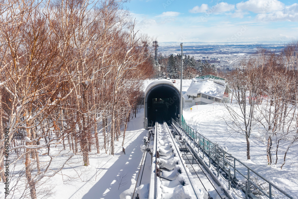 The cable car was climbing to the ropeway station on the summit of ...