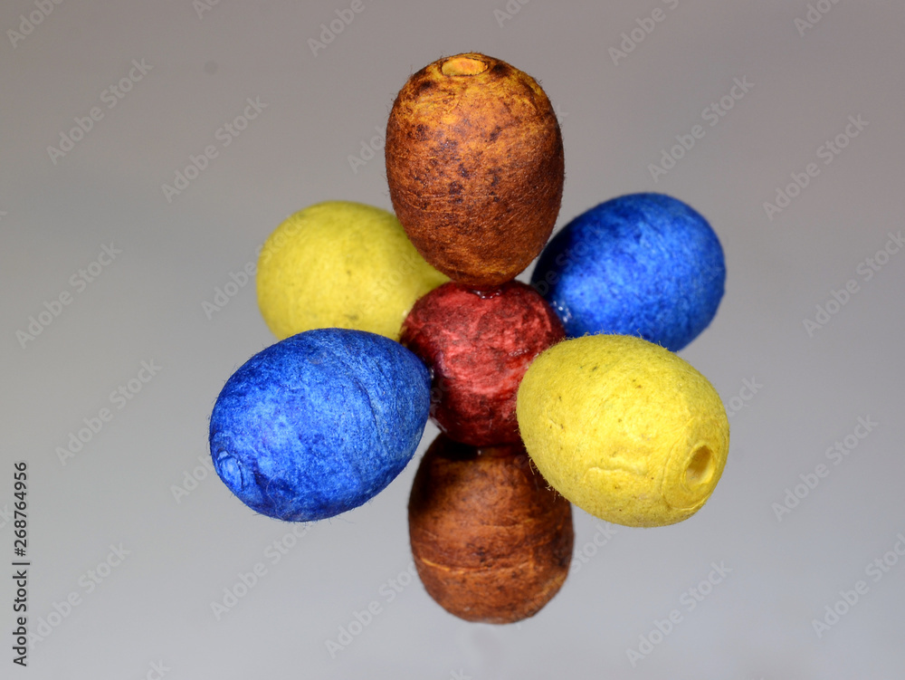 Model of an atomar nucleus (red) with pairwise colored P orbitals, the ...