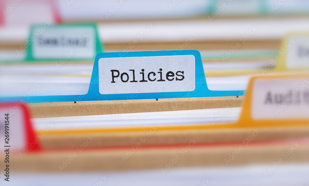 File folders with a tab labeled Policies Stock Photo | Adobe Stock