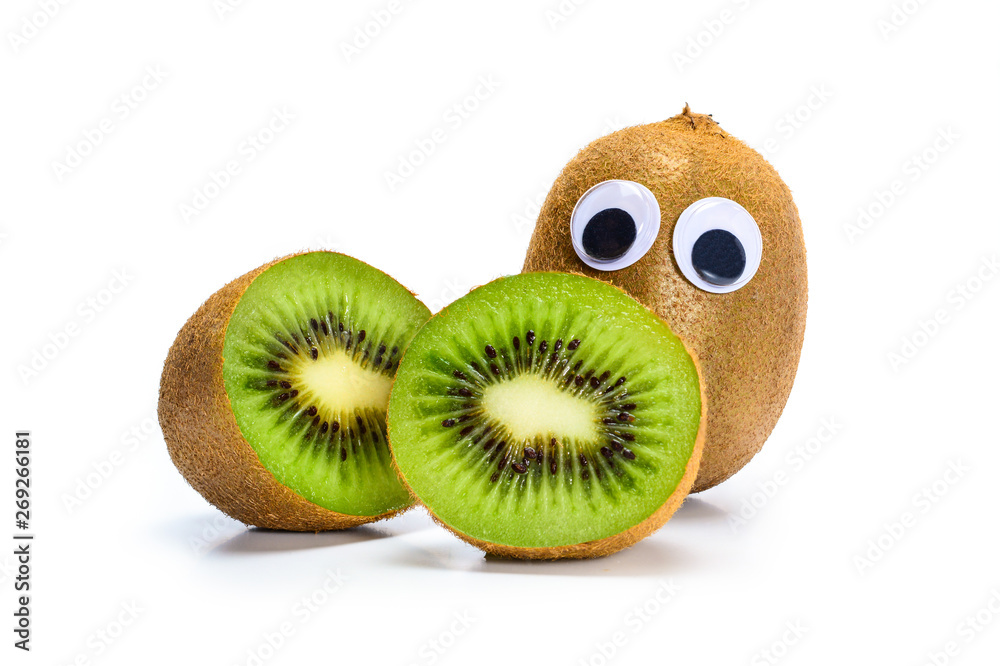 Sad kiwi fruit with googly toy eyes and one fruit cut in two halves ...