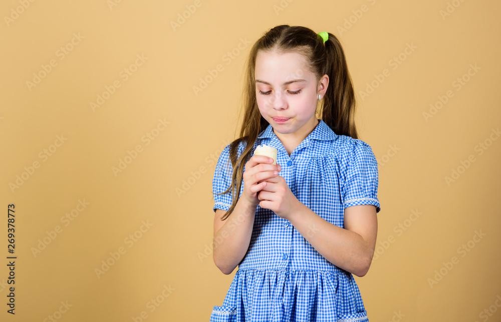 Foto de Stock More flavor more fun. Small child licking ice cream with ...