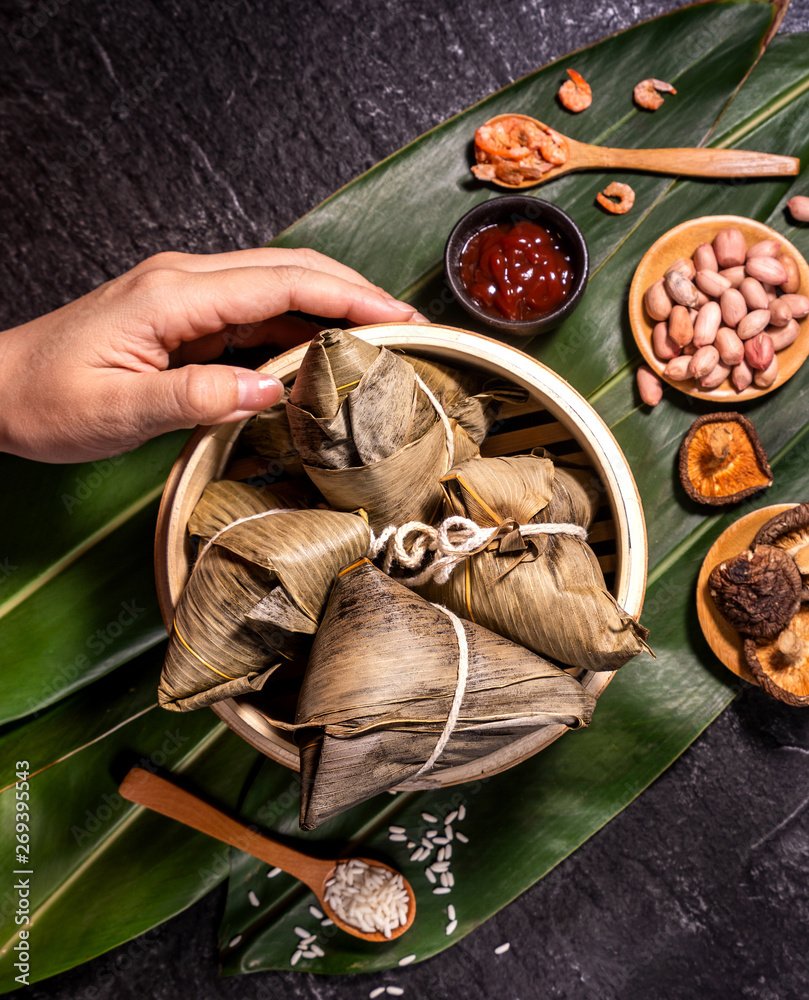 Zongzi, delicious fresh hot steamed rice dumplings in steamer. Close up ...