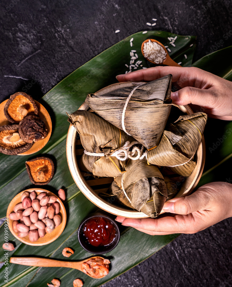 Zongzi, delicious fresh hot steamed rice dumplings in steamer. Close up ...