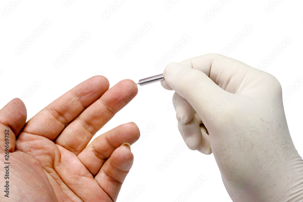 Hand of doctor in white medical glove holding blood lancet stab on ...