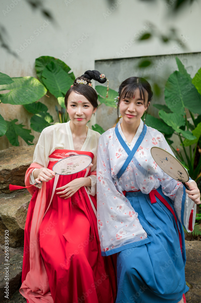 Two young women wearing in Chinese Han clothing in traditional Chinese ...