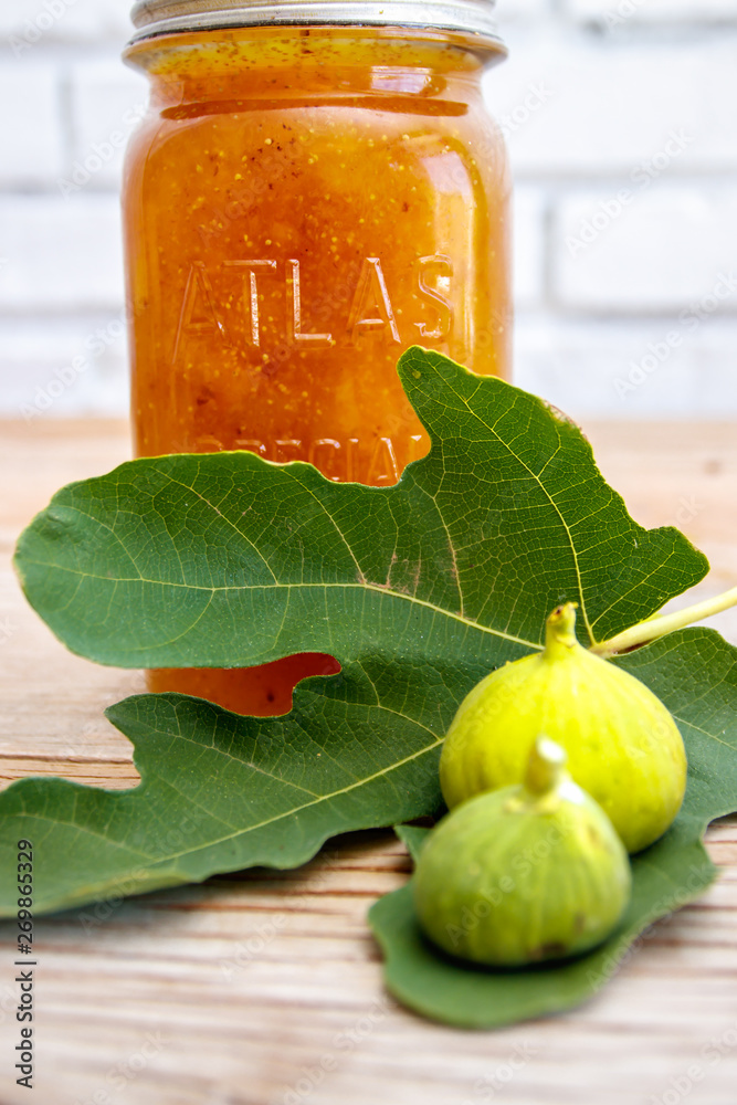 Antique glass preserve bottle with fig preserve together with a fresh ...
