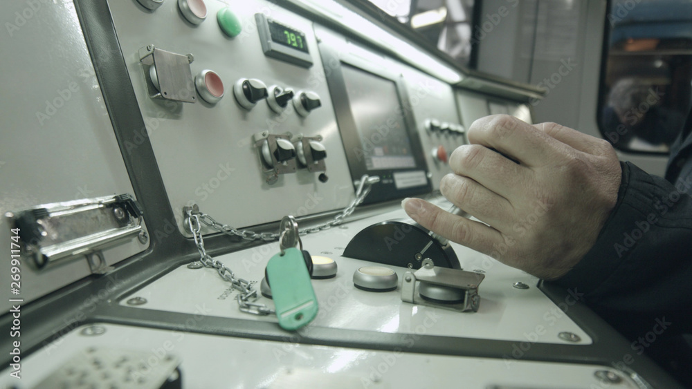 Interior control place of train, inside view. Train driver hand on ...