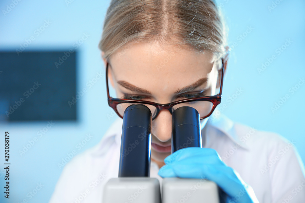 Female scientist using modern microscope in chemistry laboratory Stock ...