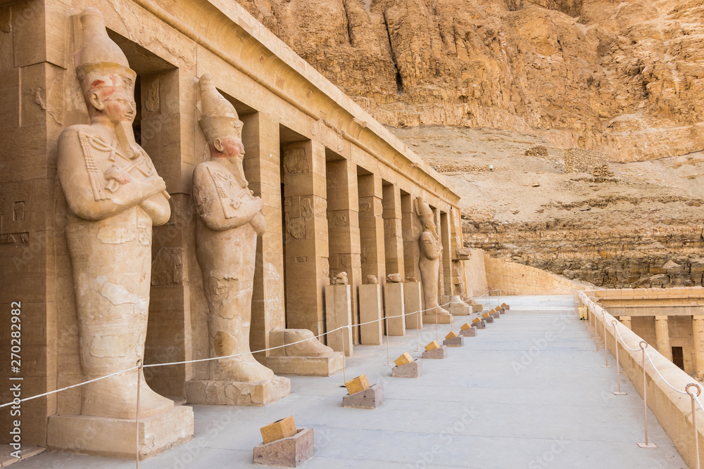 Hatshepsut statues by the columns on the highest terrace of the Mortuary Temple of Hatshepsut ...