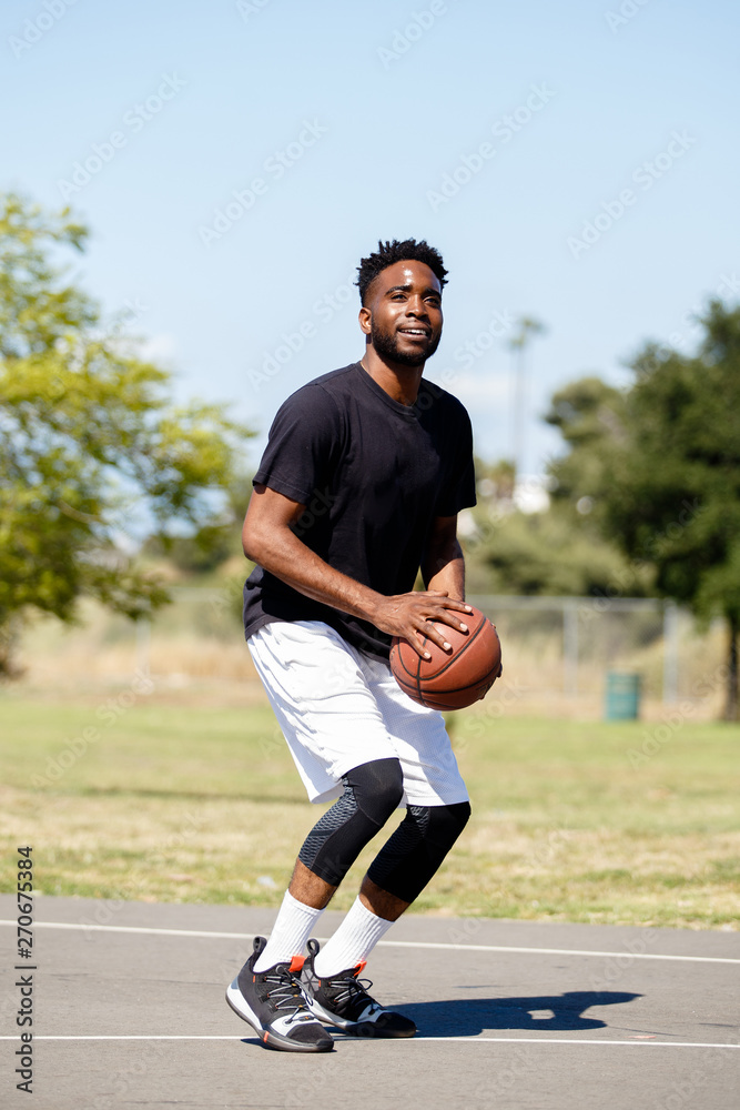 Young black man playing basketball Stock Photo Adobe Stock