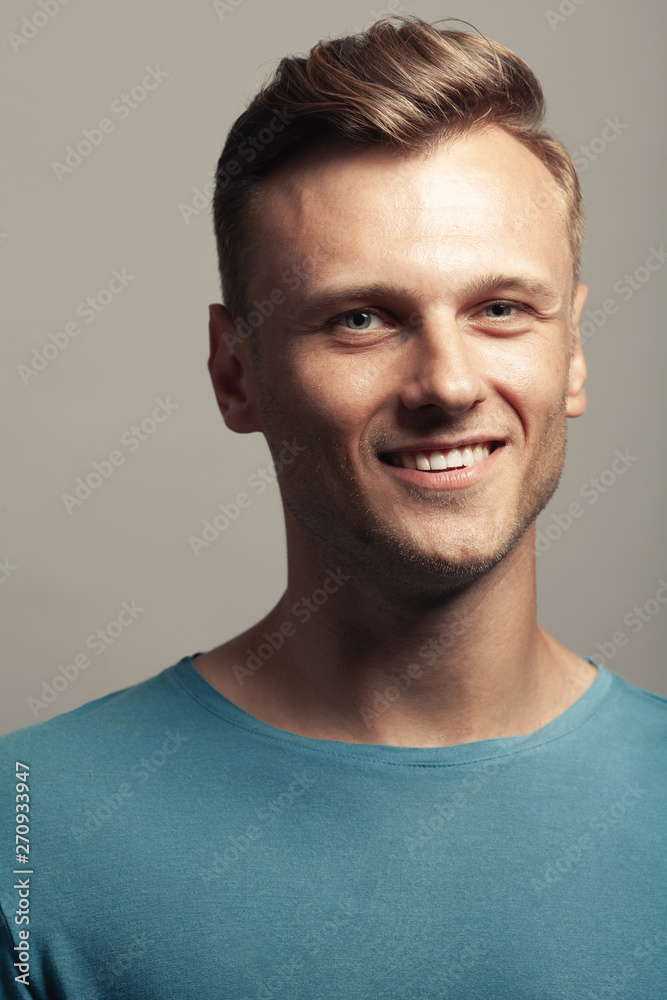 Fabulous at any age. Portrait of handsome 30-year-old man with blue ...