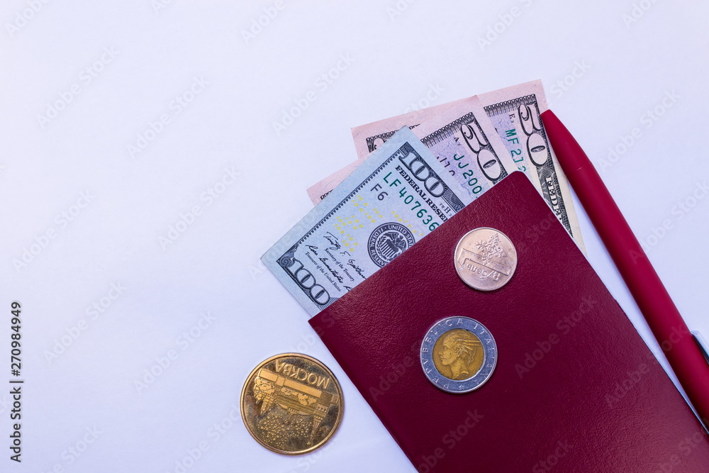 Paper money (dollars), coins of various countries, a ballpoint pen and ...