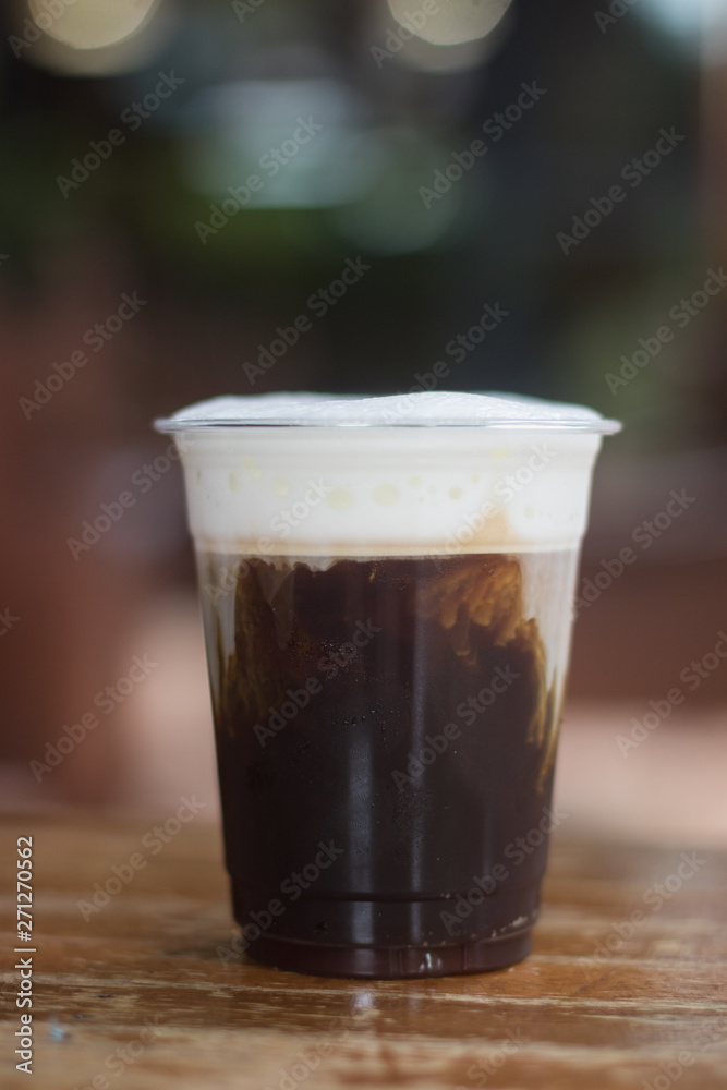 Sparkling Nitro Cold Brew Coffee ready to drink.Outdoor cafe in ...