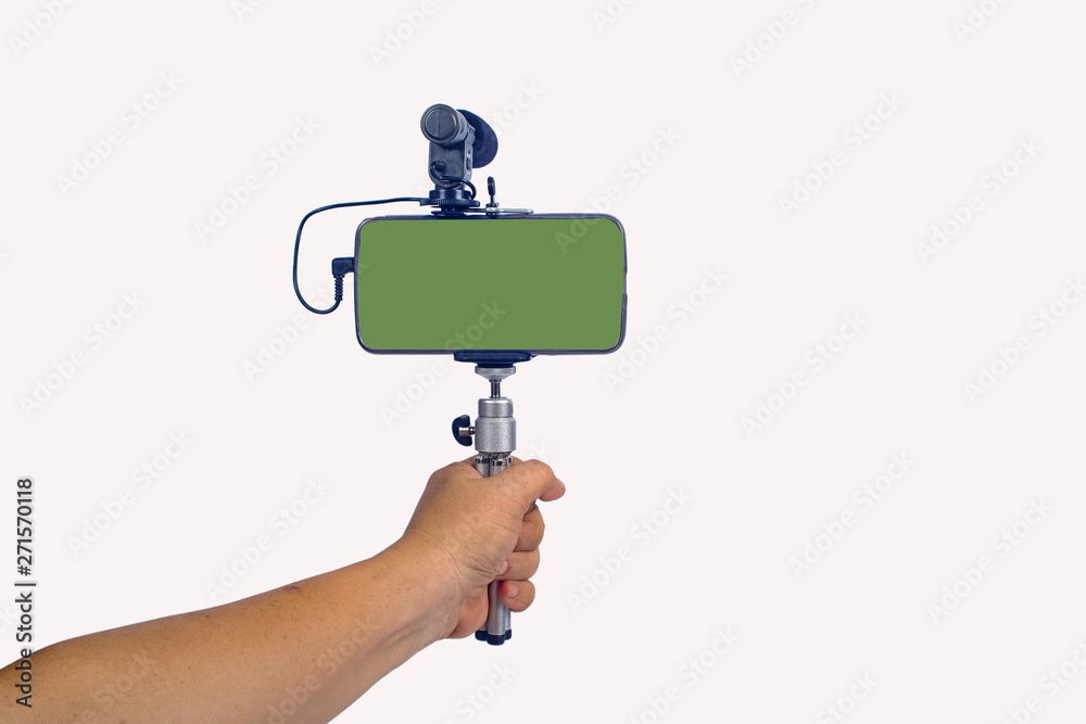 streaming video live with smart phone and microphone tool in hand ...