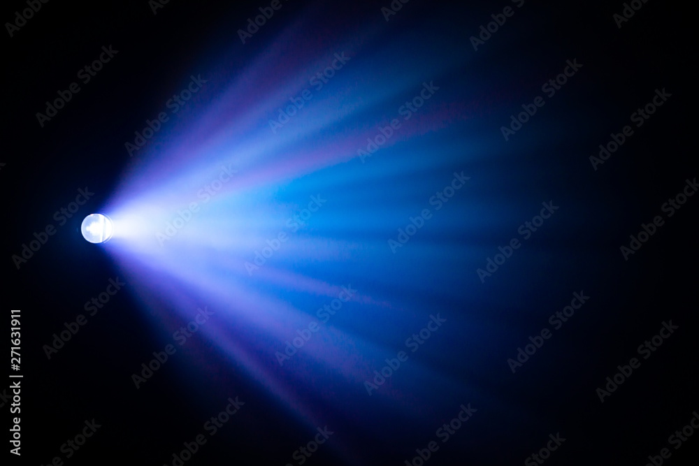 blue purple spotlight projector on abstract smoke texture . glowing ...