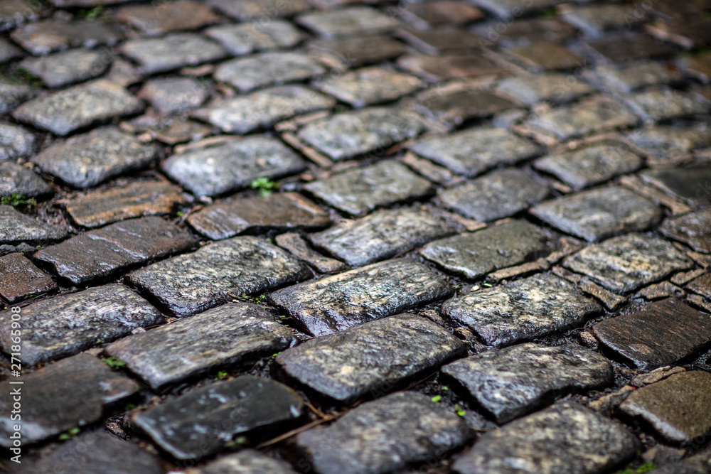 Stone pavement texture. Granite cobblestoned pavement background. Cobbled stone road regular ...