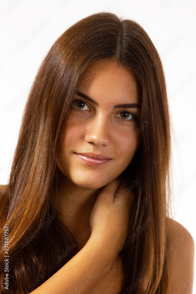 Beauty feminine portrait of female face with healthy natural skin. Beautiful tanned teen girl ...