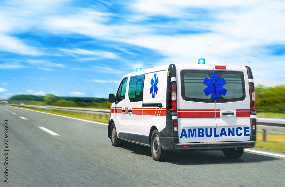 Ambulance van on highway with flashing lights Stock Photo | Adobe Stock
