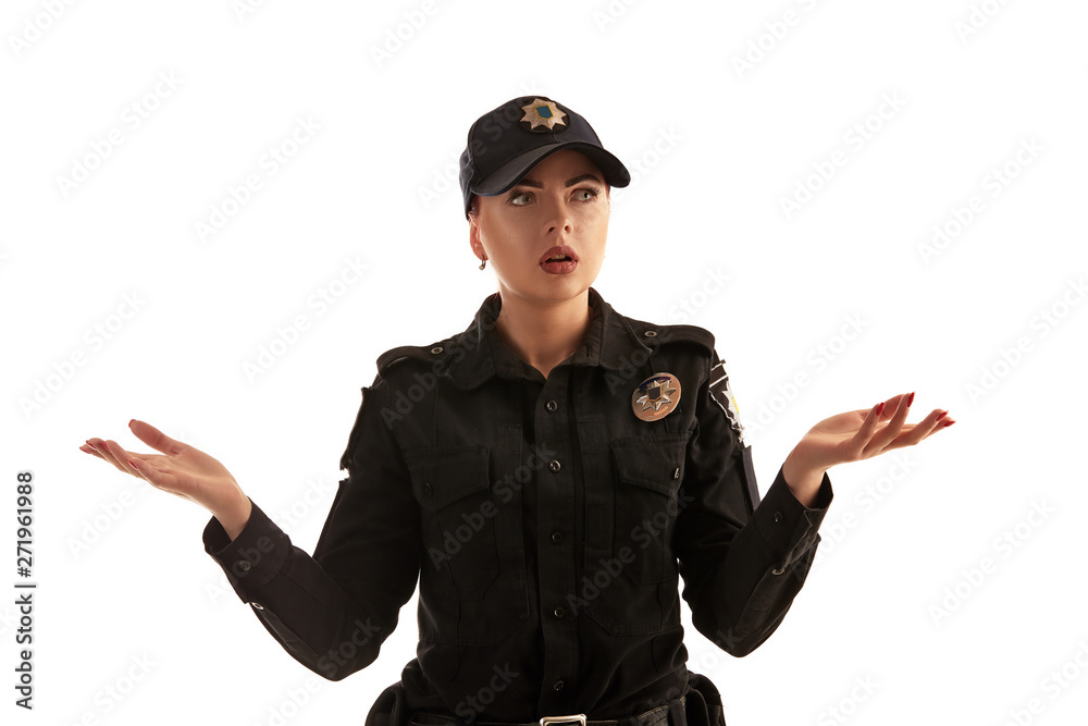 Close-up shot of a redheaded female police officer posing for the ...