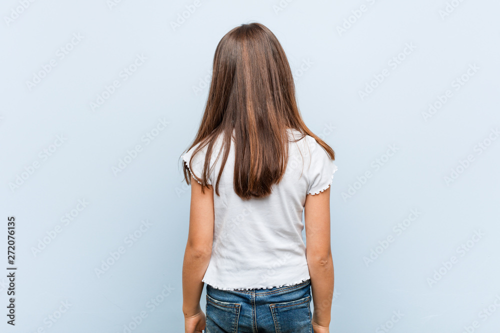 ภาพถ่าย Stock Cute girl from behind, looking back. | Adobe Stock