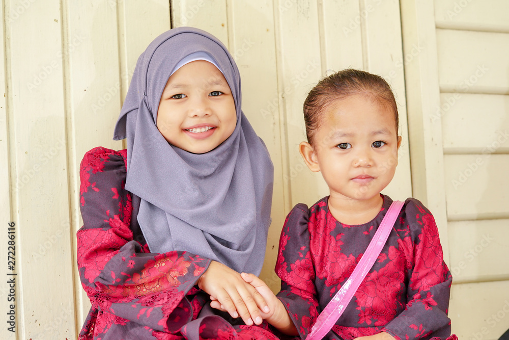 Portrait of two siblings, sister handshaking ask for forgiveness to ...