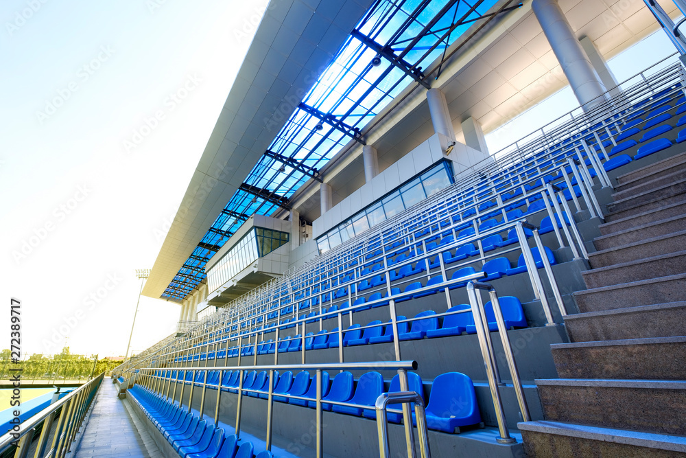 Blue plastic seats. Free arena seating. Empty plastic chairs seats for ...