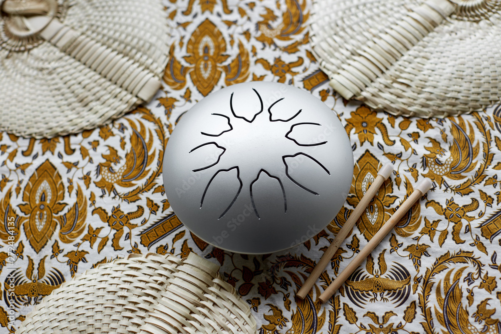 Metal instruments, empty drums, handpan. A desktop background featuring ...