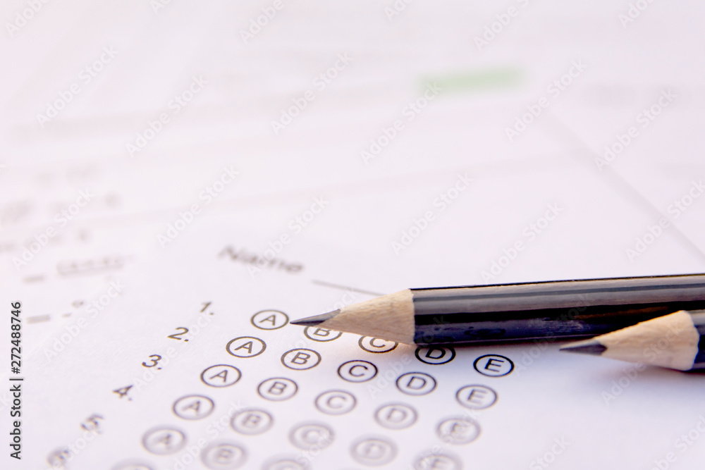 Pencil on answer sheets or Standardized test form with answers bubbled ...