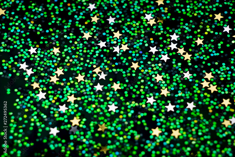 Electric Stars A sea of glowing green sparkles and golden stars ...