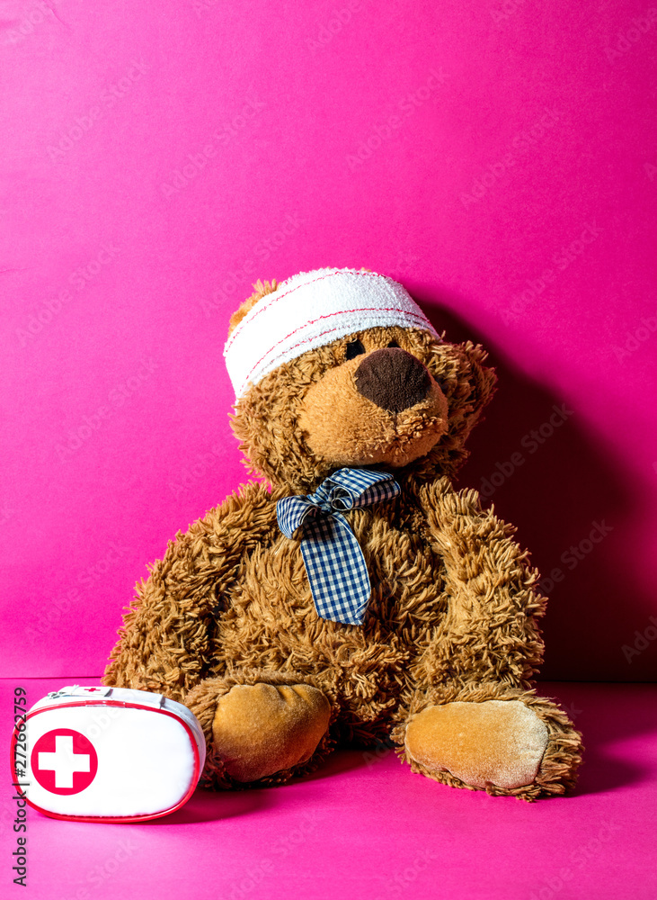 Teddy bear with bandage and first aid for mishap concept Stock Photo ...