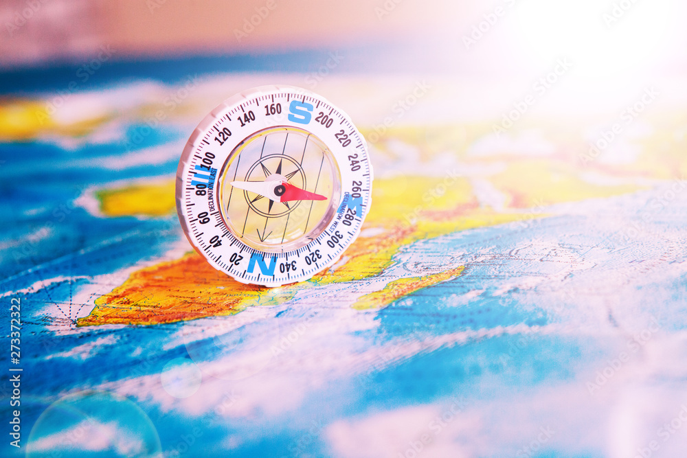 Compass on map. The magnetic compass is located on a geographic map ...