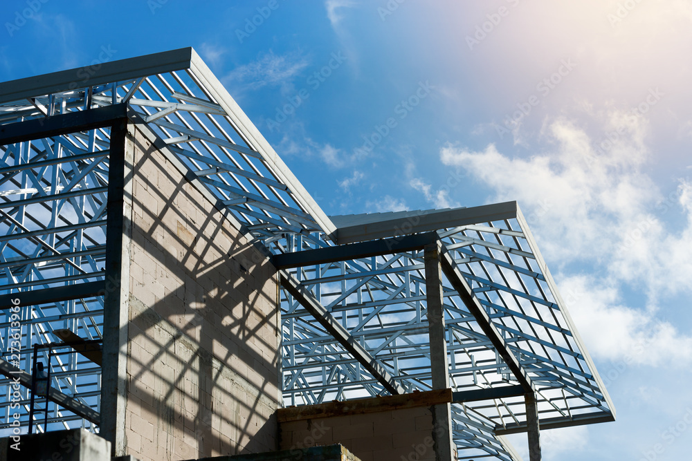 Roof frame of under construction house..Metal roof frame structure of a ...