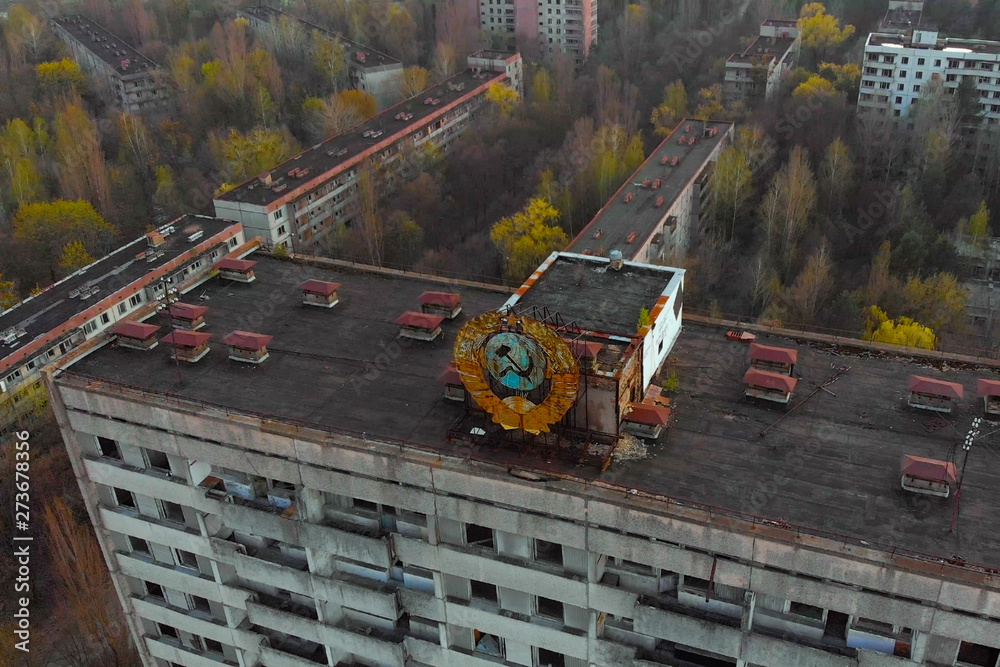 Soviet coat of arms on a high-rise building in Pripyat, view from above ...