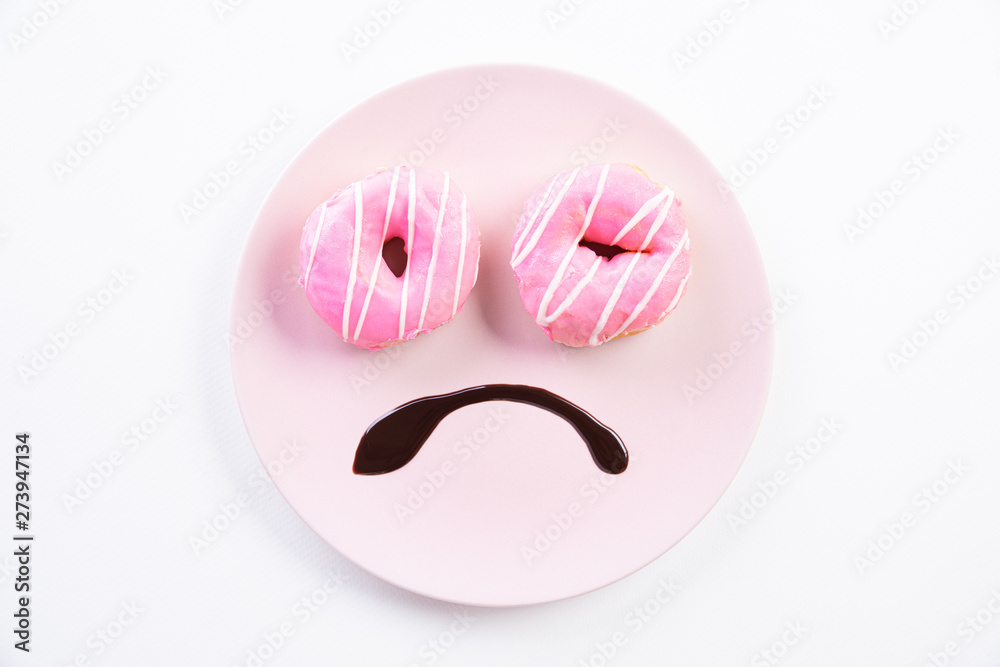 Top view of smiley sad face worried about overweight made on dish with ...